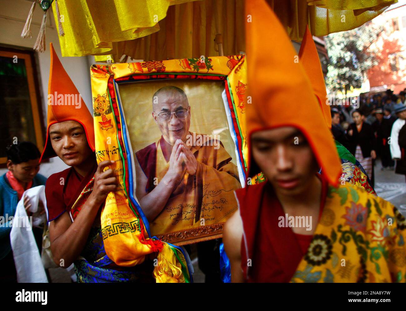 Exile Tibetan Buddhist monks carry Tibetan spiritual leader the Dalai ...