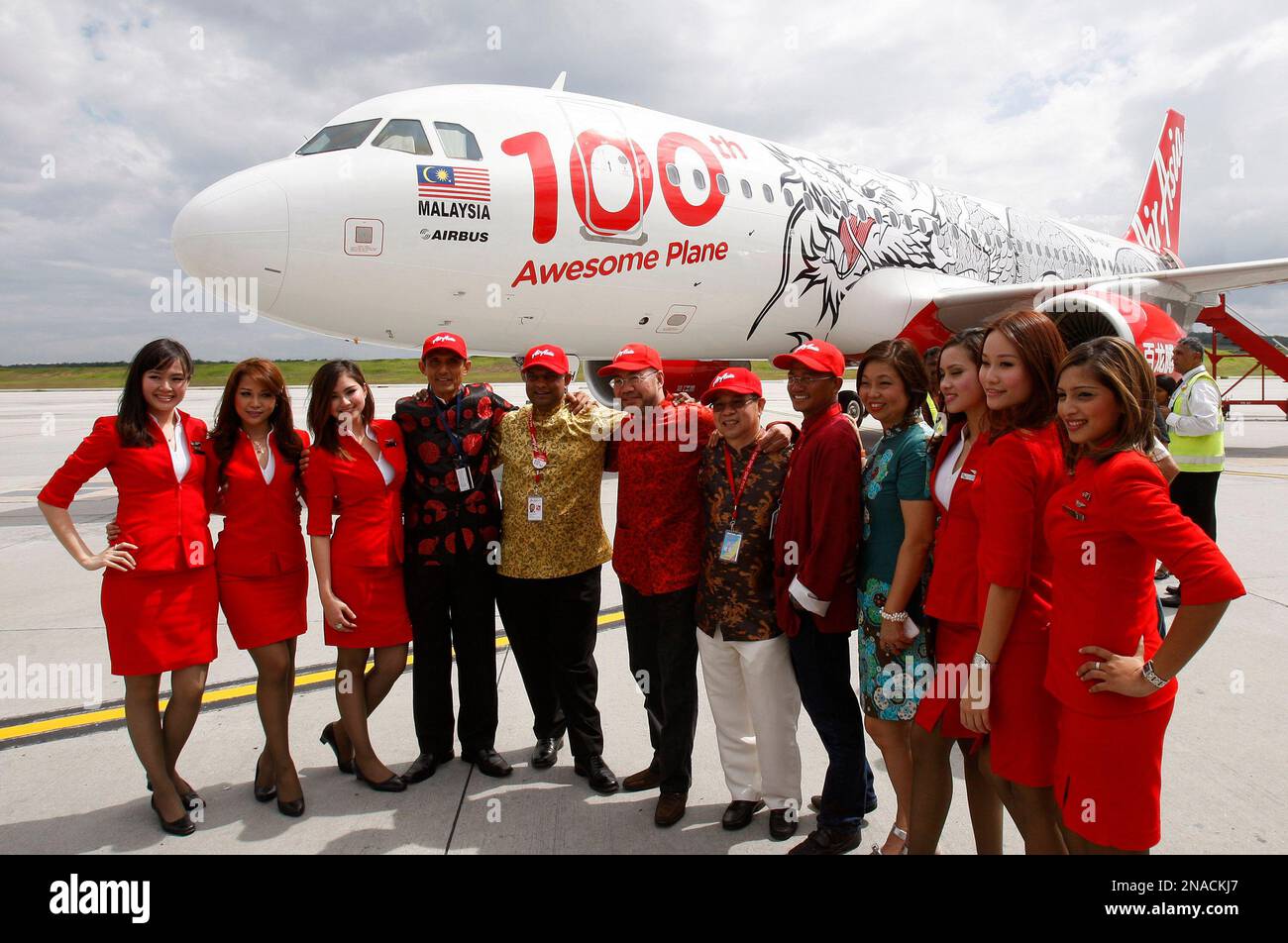 AirAsia Chief Executive Tony Fernandes, fifth from left, poses with his ...