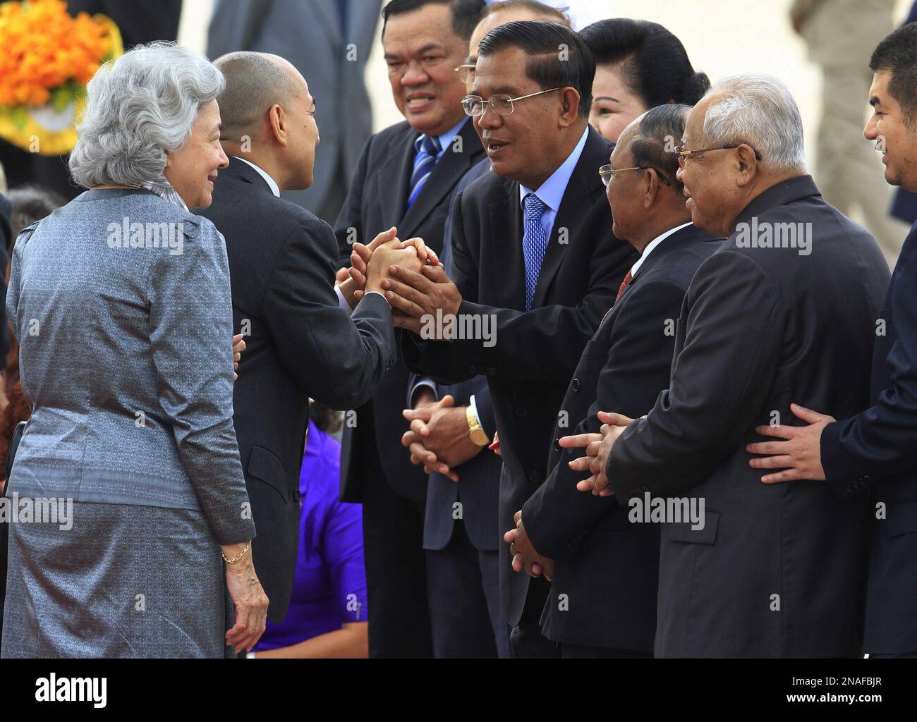 Cambodia's King Norodom Sihamoni, second left, accompanied by his ...