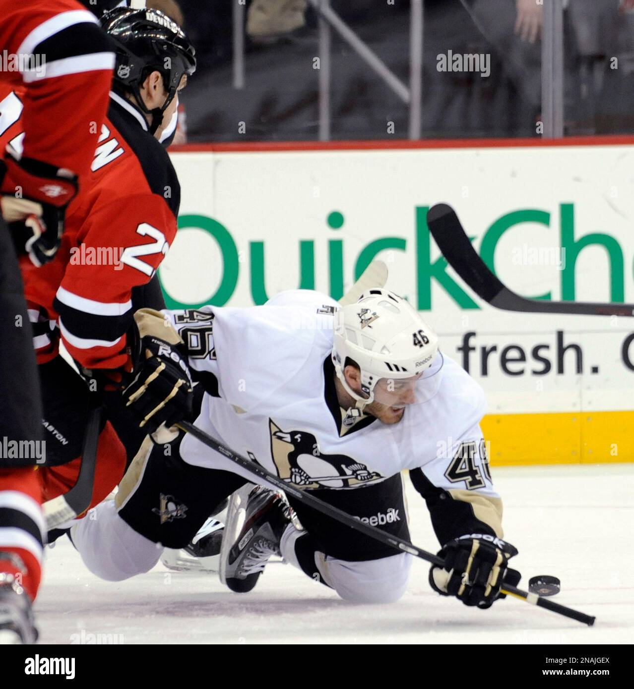 Pittsburgh Penguins' Joe Vitale is checked to the ice by New Jersey ...