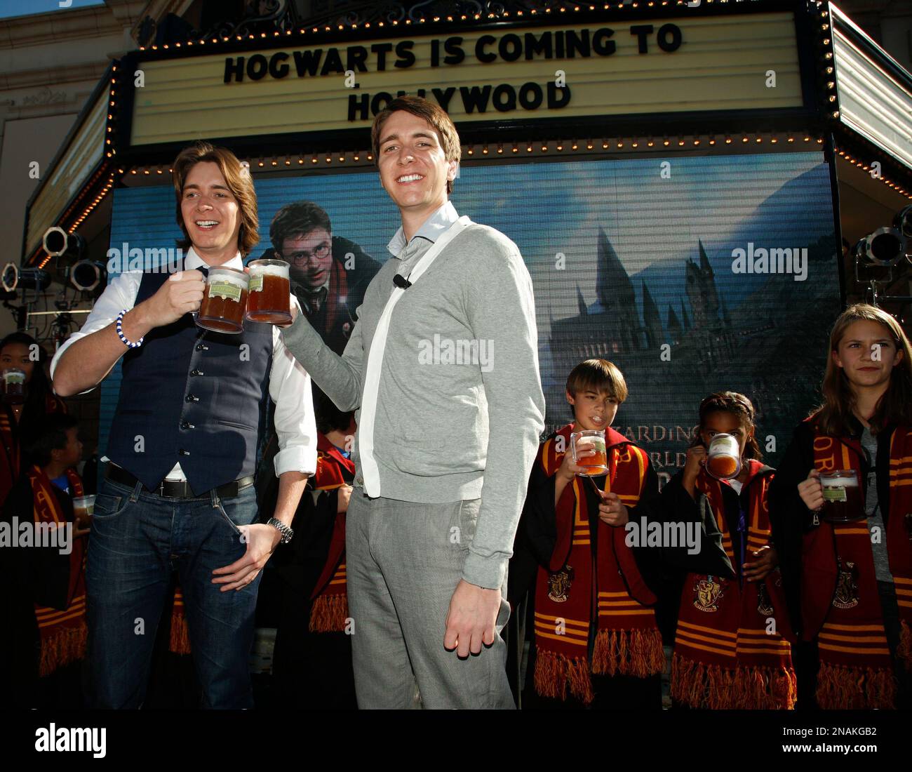 Harry Potter cast members James Phelps, left, and Oliver Phelps make a ...