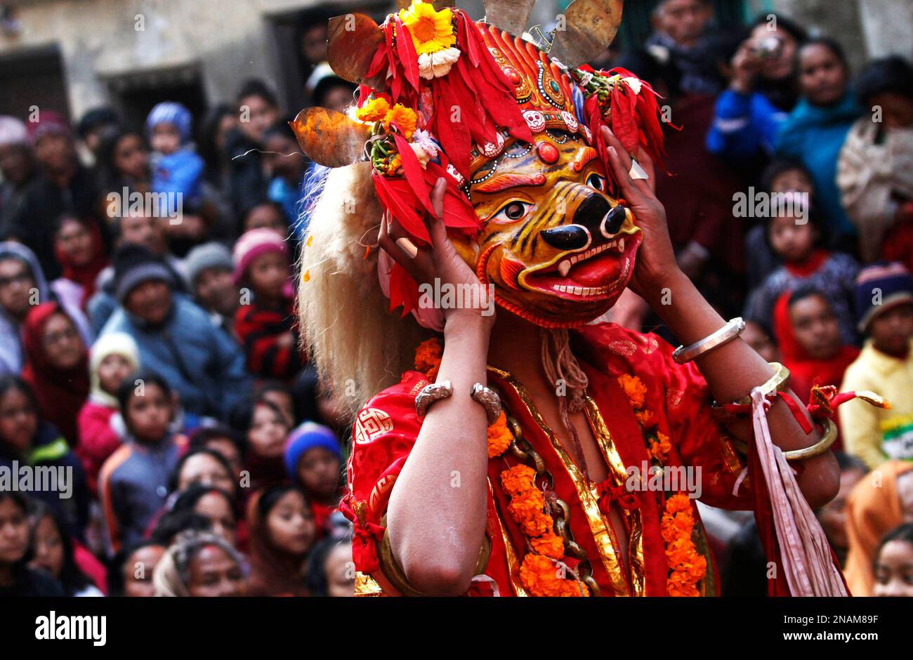 A masked artist performs a traditional dance during Khadgha Siddhi ...