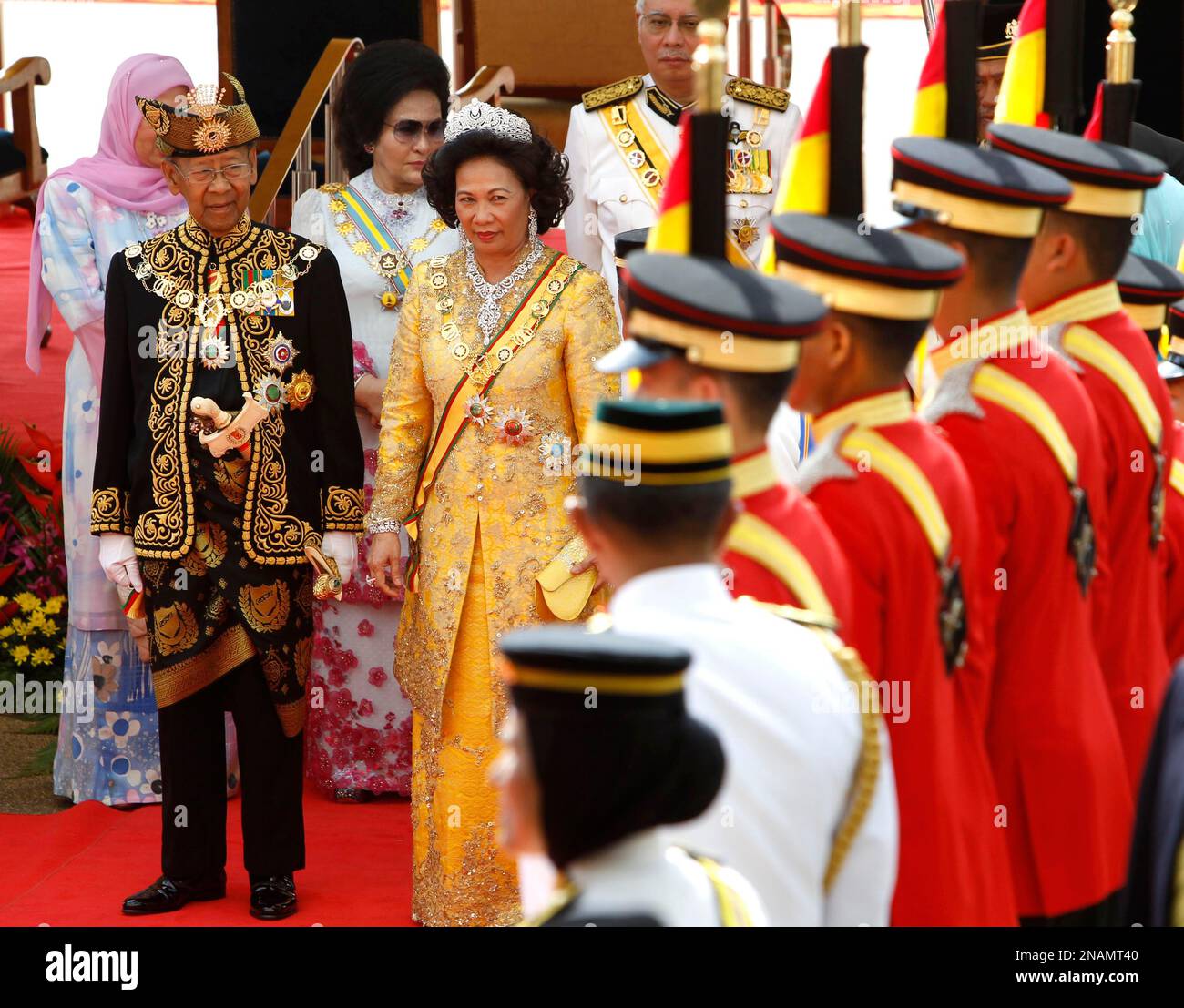 Malaysia's new King Sultan Abdul Halim, front left, Queen Haminah stand ...
