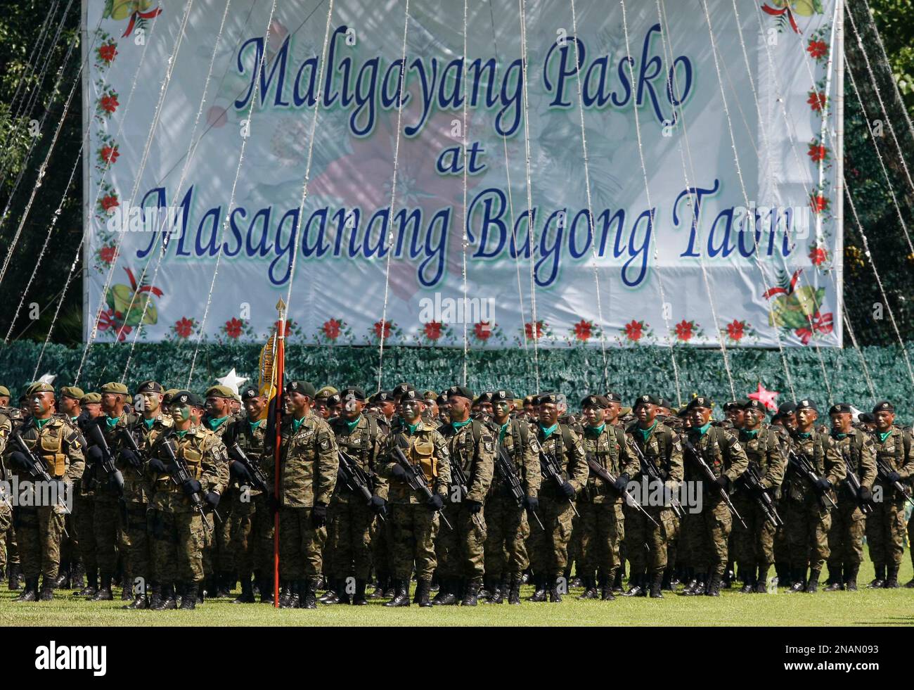 Filipino soldiers stand at attention during the turnover-of-command ...