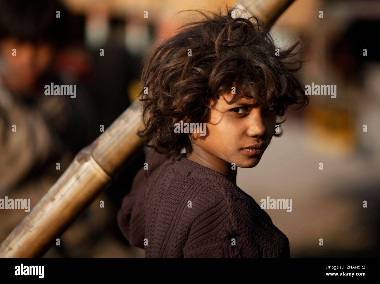 In this Saturday, Dec. 10, 2011 photograph, an Indian rag picker child ...