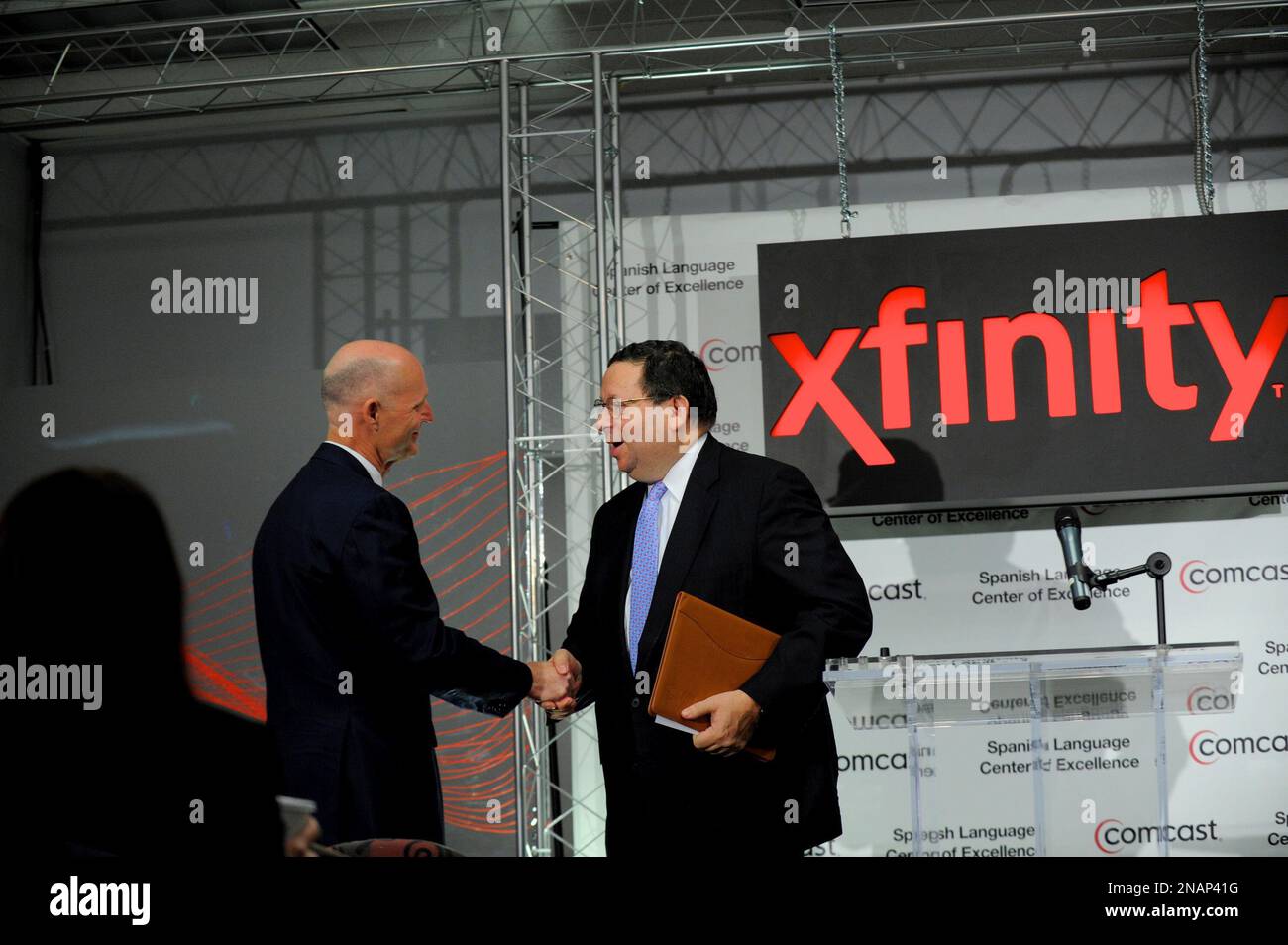 Florida Gov. Rick Scott, left, is introduced by Comcast Corporation ...