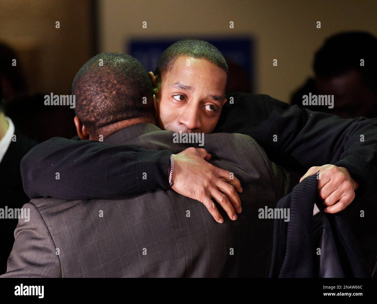 Terrill Swift, right, is hugged outside the Cook County Criminal Courts ...