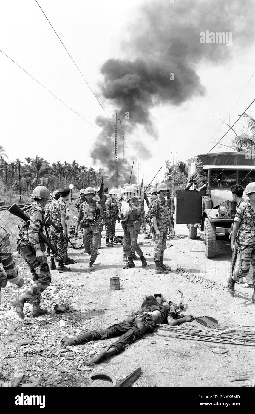 **Eds Note: Graphic Content** A dead Viet Cong in the foreground and ...