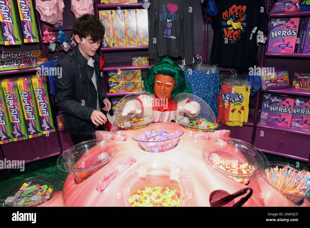 Greyson Chance swaps candy with an Oompa Loompa at the Wonka Candy ...