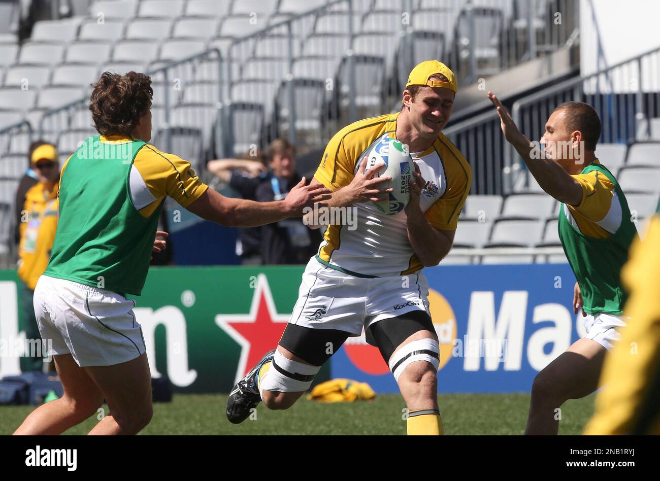 Australian rugby captain James Horwill center, runs between players ...