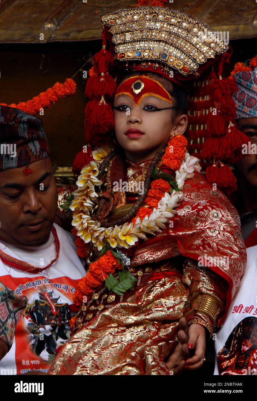 Devotees carry Nepal's living goddess, locally known as Kumari, for a ...
