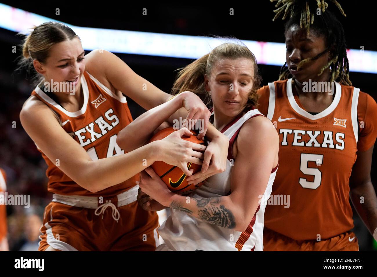 Iowa State guard Denae Fritz, center, fights for a rebound with Texas ...