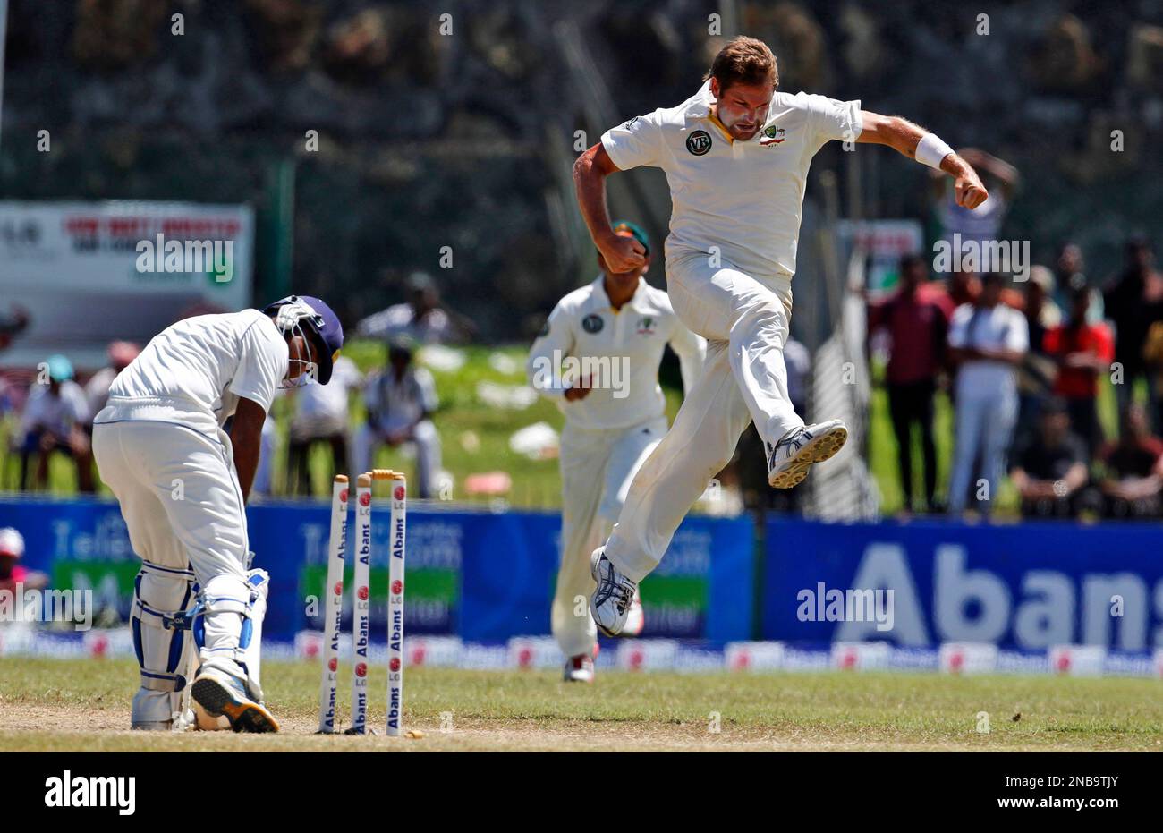Australia's bowler Ryan Harris, right, celebrates the dismissal of Sri ...