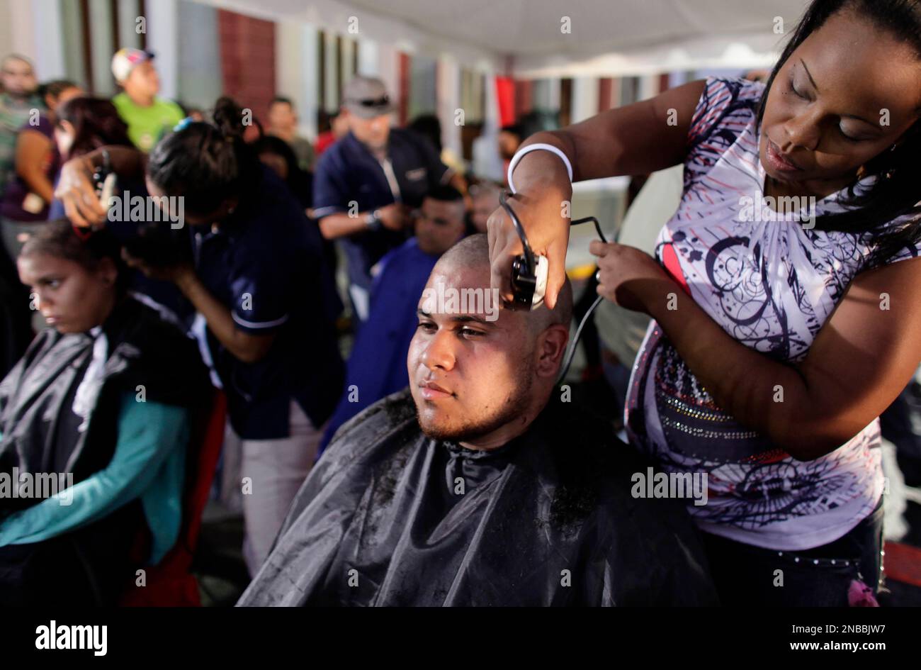 People have their heads shaved in solidarity with Venezuela's President ...