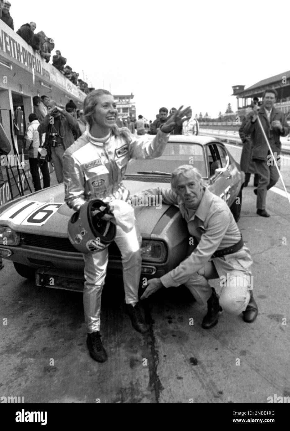 German woman racing driver Hannelore Werner sits on the hood of a Ford ...