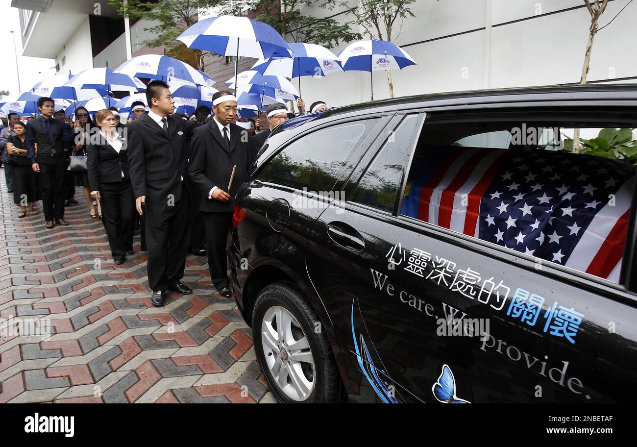 Family members walk behind the hearse carrying the coffin of South ...