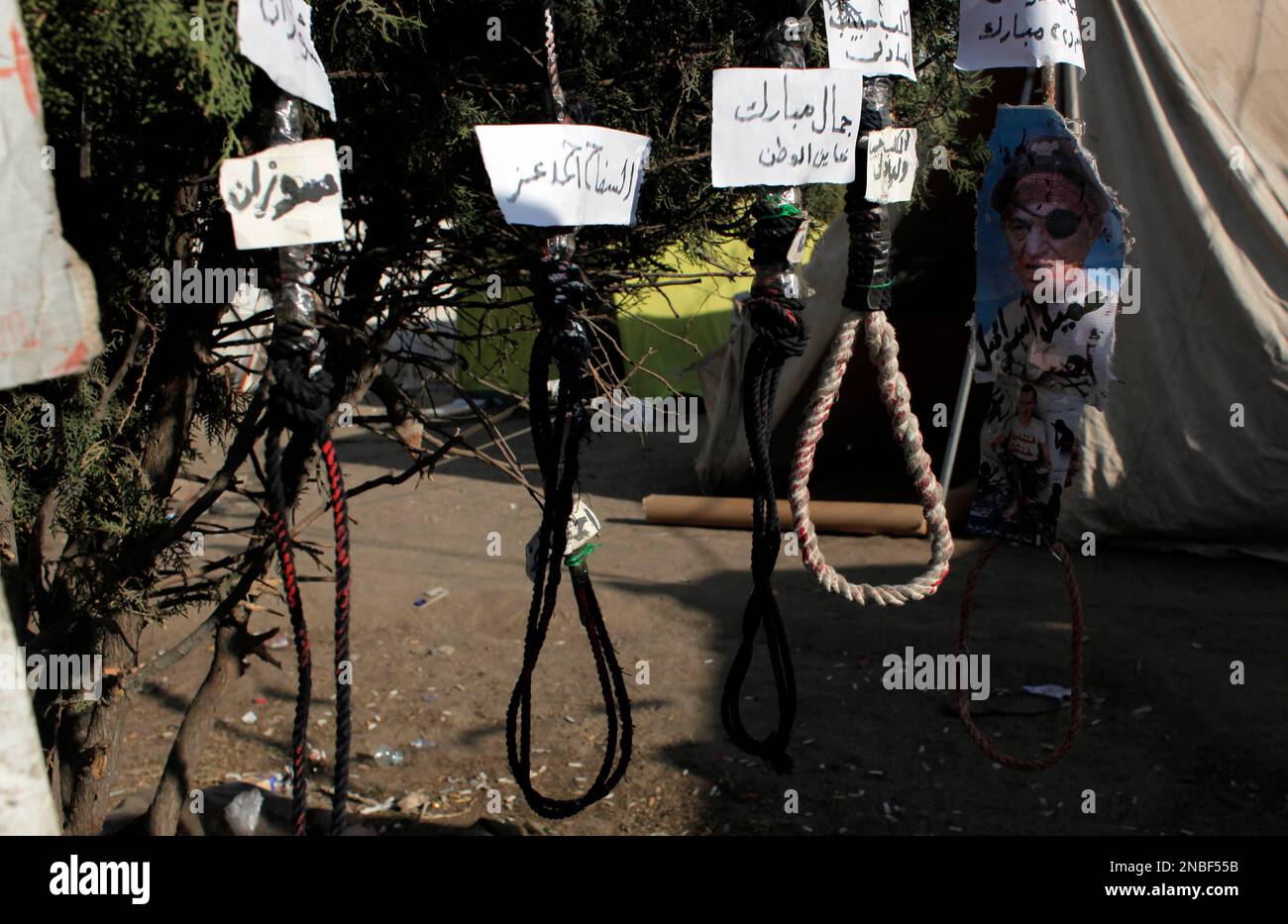 Hanging ropes with names in Arabic for officials from the ousted regime ...