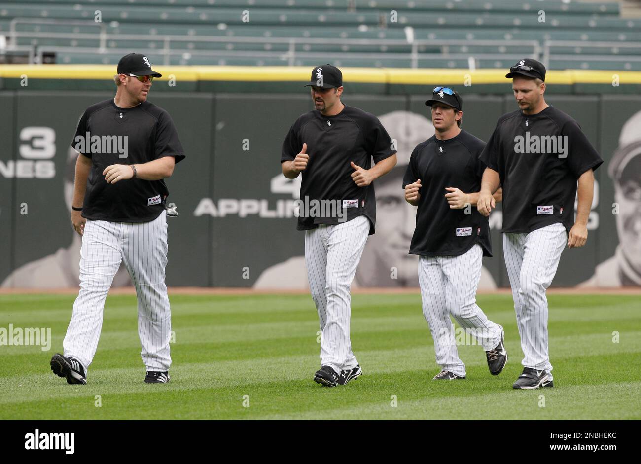 Chicago White Sox's Paul Konerko, second from left, talks to Adam Dunn ...