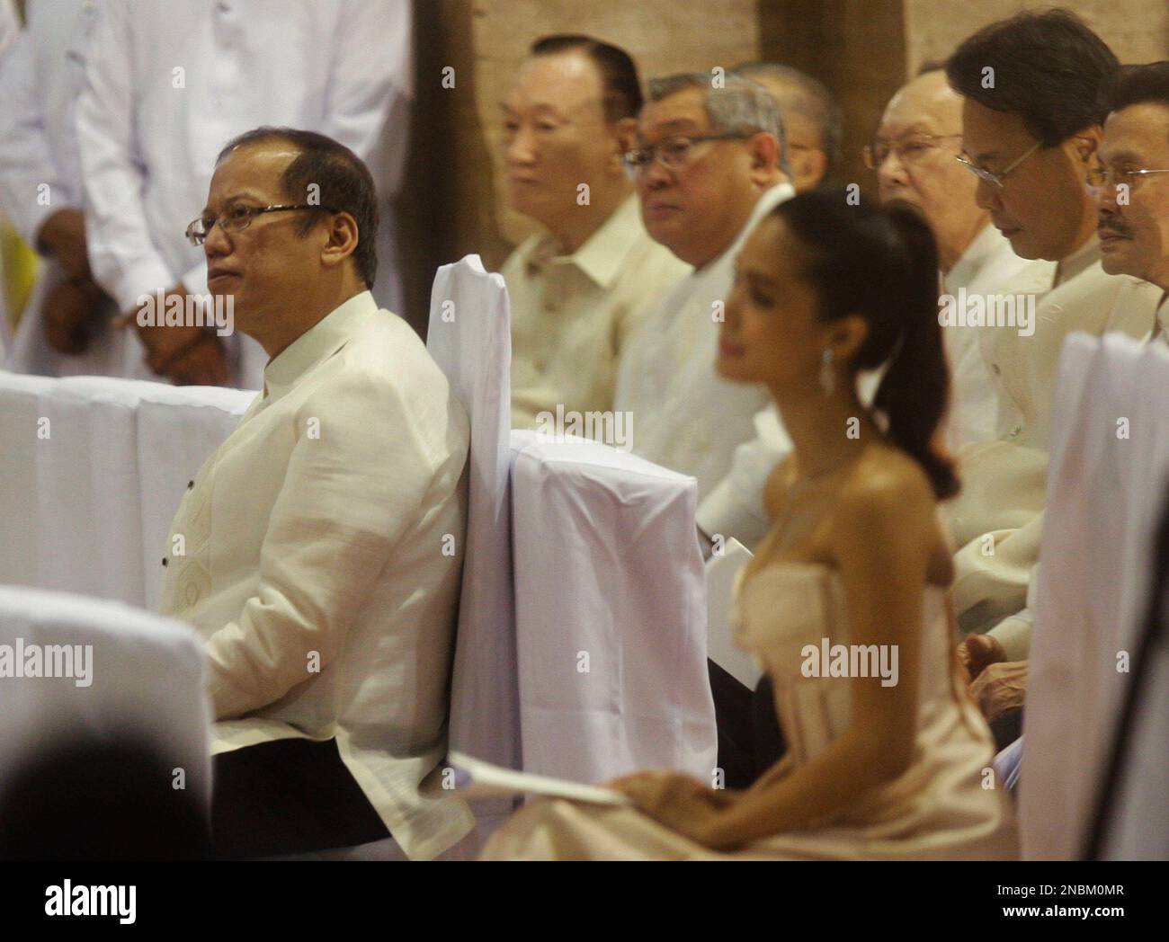 Philippine President Benigno Aquino III, left, listens to a mass during ...