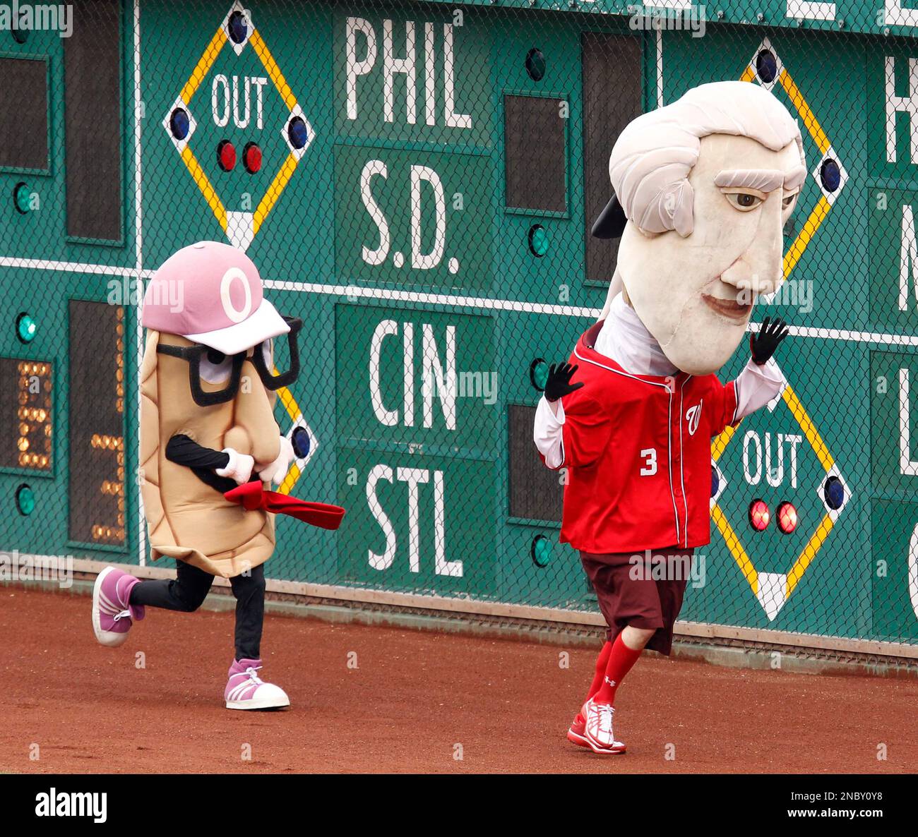 The Pittsburgh Pirates' racing pierogi Oliver Onion, left, races Thomas ...