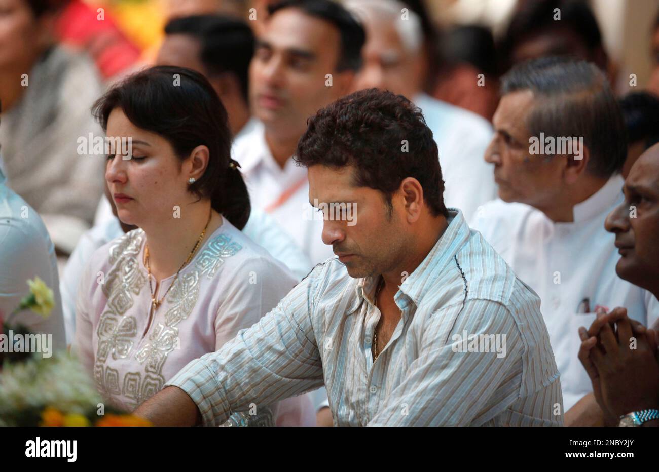 Legendary Indian cricketer Sachin Tendulkar, second left, sits with his ...