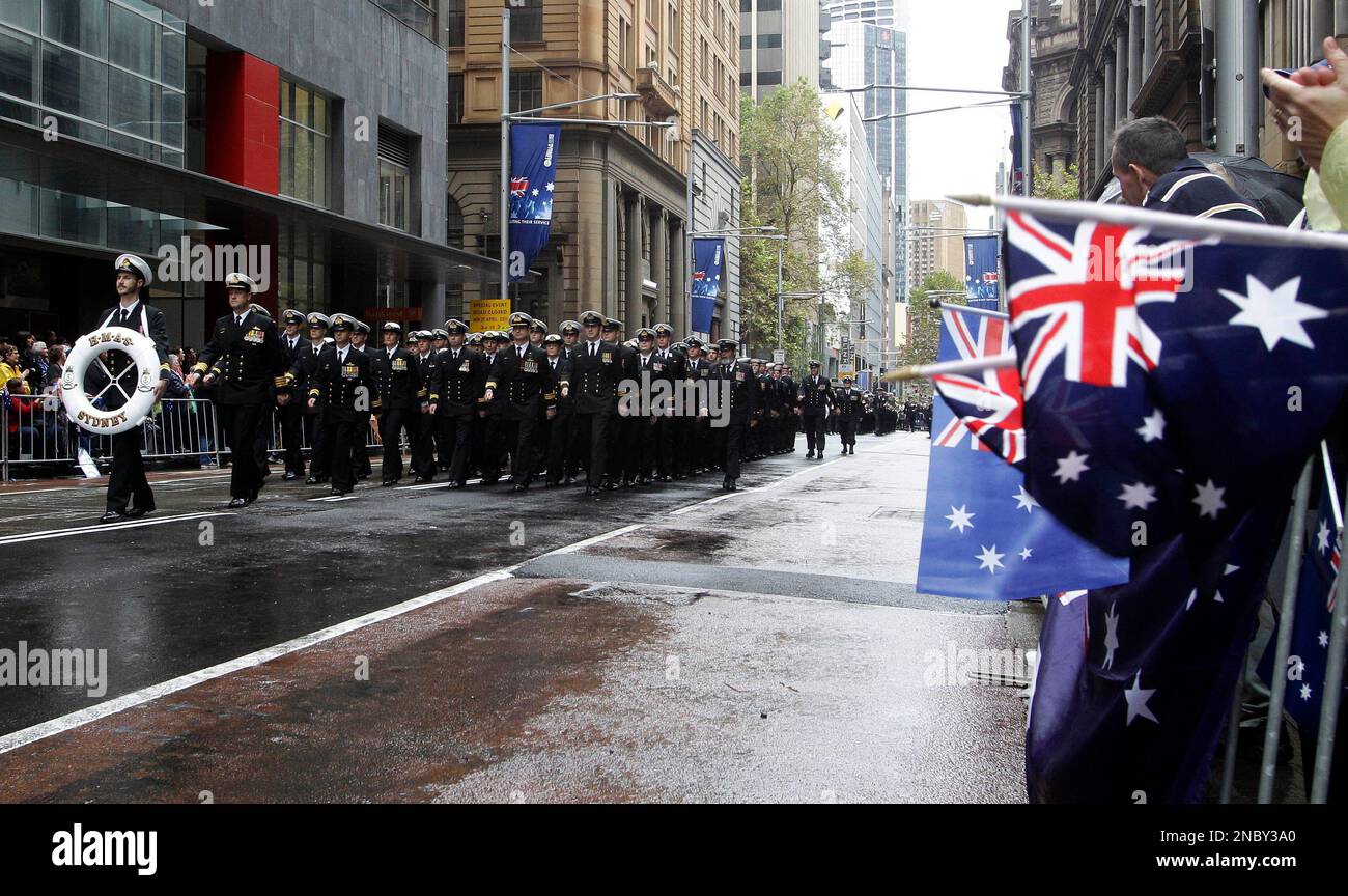 Members from the Australian warship HMAS Sydney march during an annual ...
