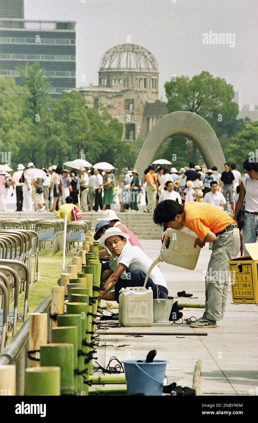 Local workers are busy in Hiroshima, Japan on August 5, 1990 to prepare ...
