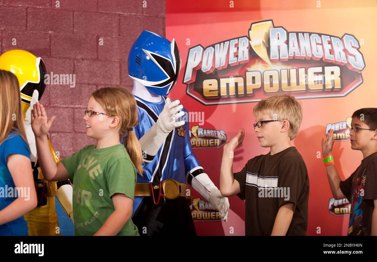 Students at Reagan Elementary give the Power Rangers high-fives ...