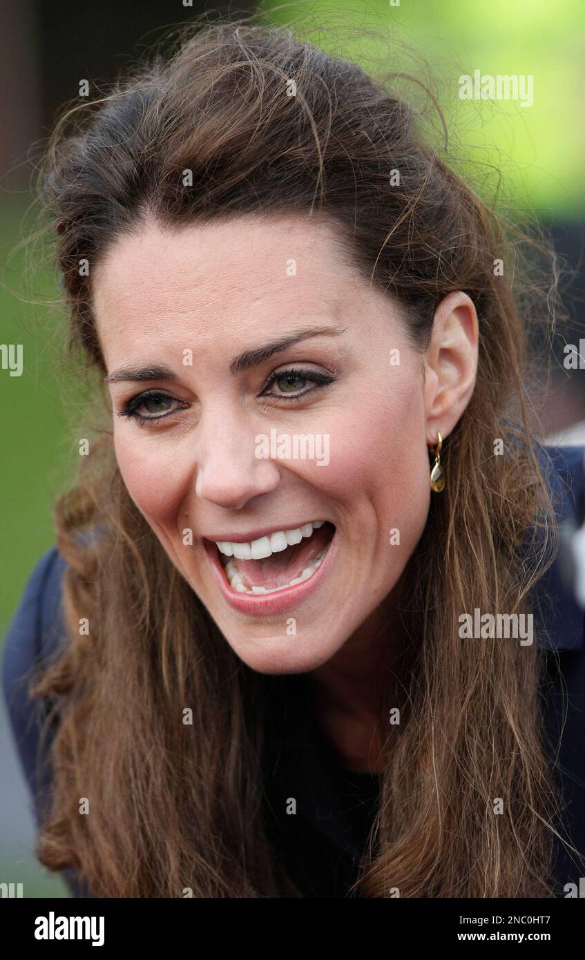Kate Middleton reacts to the crowd, during a visit to Witton County ...