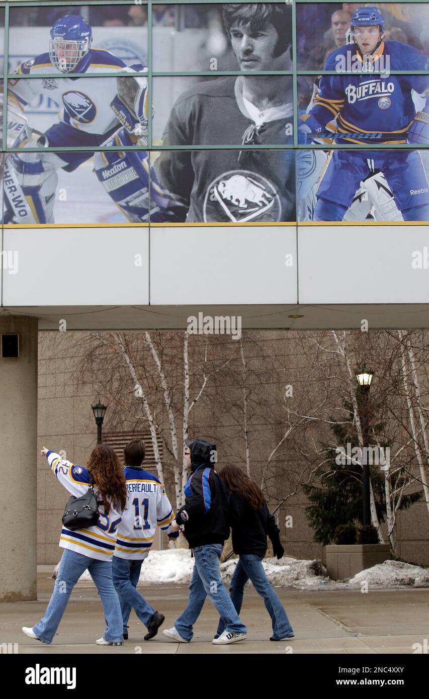 Buffalo Sabres fans walk to the arena for an NHL hockey game against ...