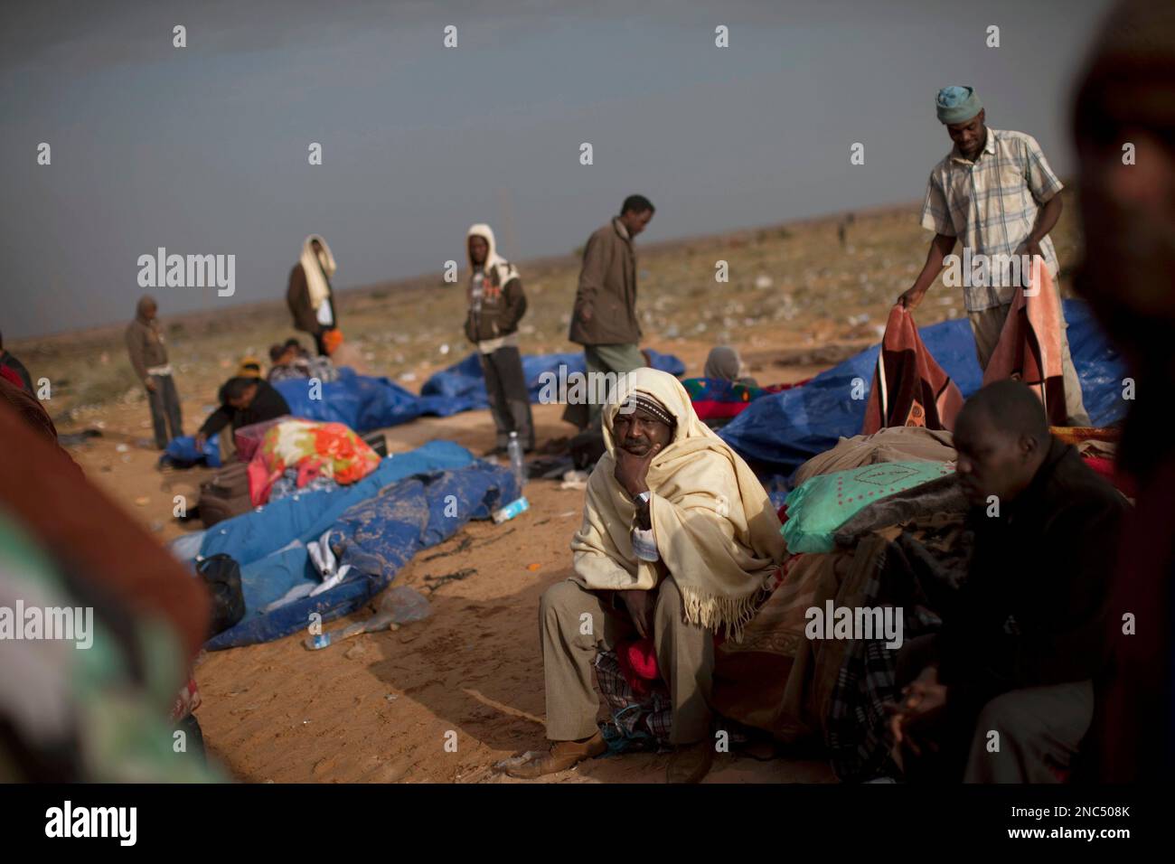 Men from Sudan, who used to work in Libya and fled the unrest in the ...