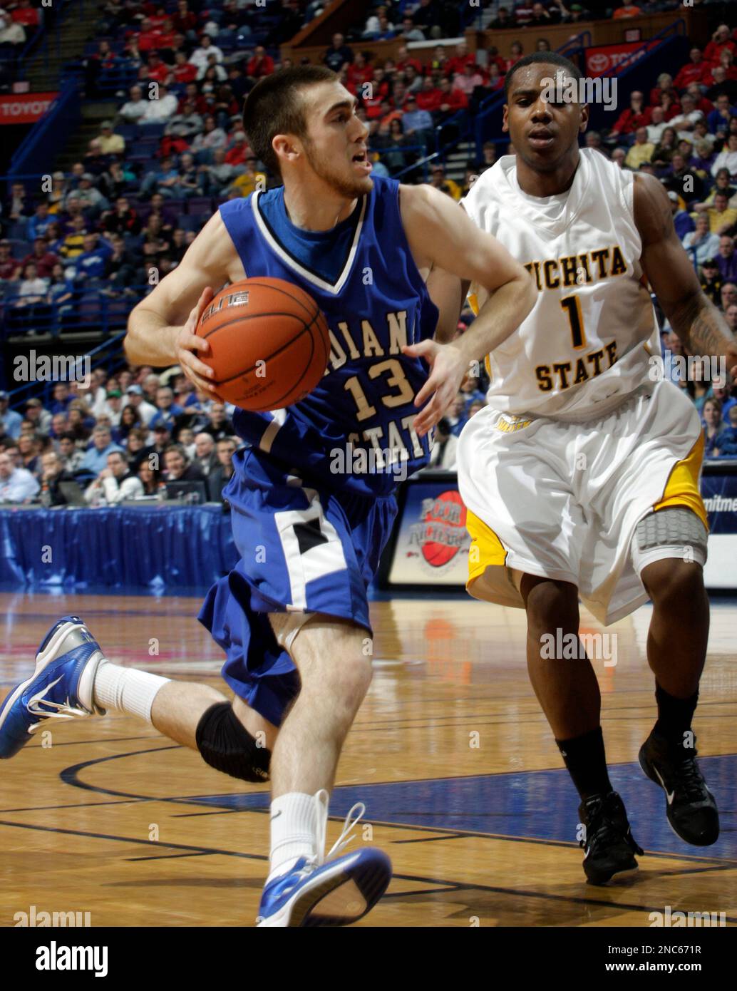 Indiana State's Jake Odum (13) drives around Joe Ragland (1) during the ...