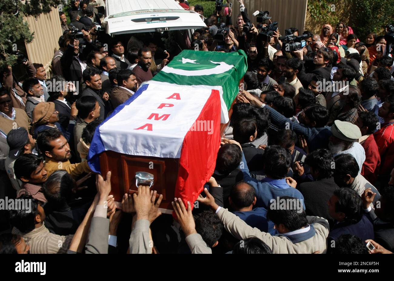 People carry the coffin of slain Christian leader Shahbaz Bhatti from a ...