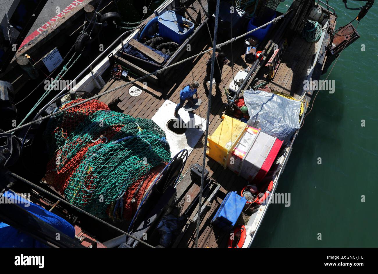 First Mate Joleen Lambert-Skinner does maintenance on the fishing boat ...