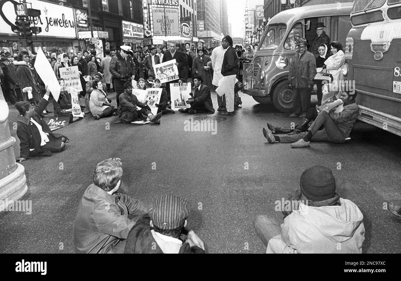 Bus and other vehicular traffic halts at a major downtown business ...