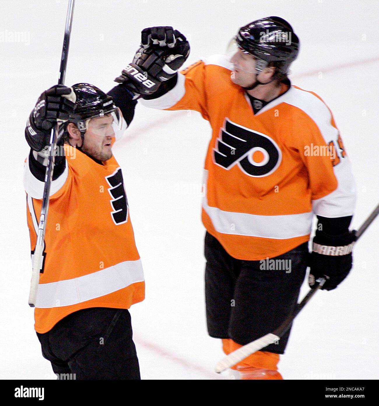Philadelphia Flyers' Andrej Meszaros, left, celebrates his goal with ...