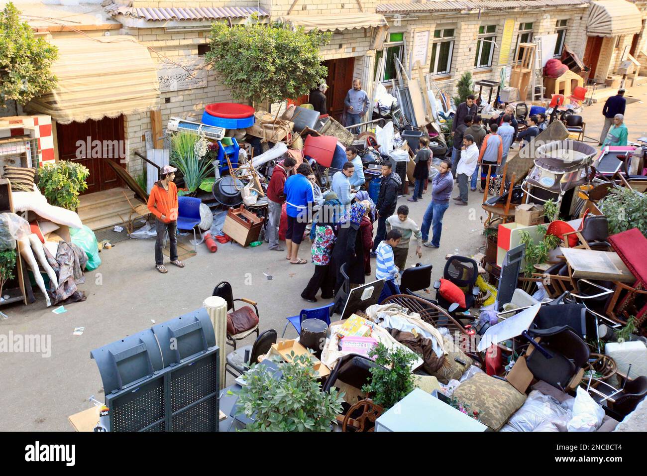 Egyptian volunteers guard looted goods confiscated from looters in ...