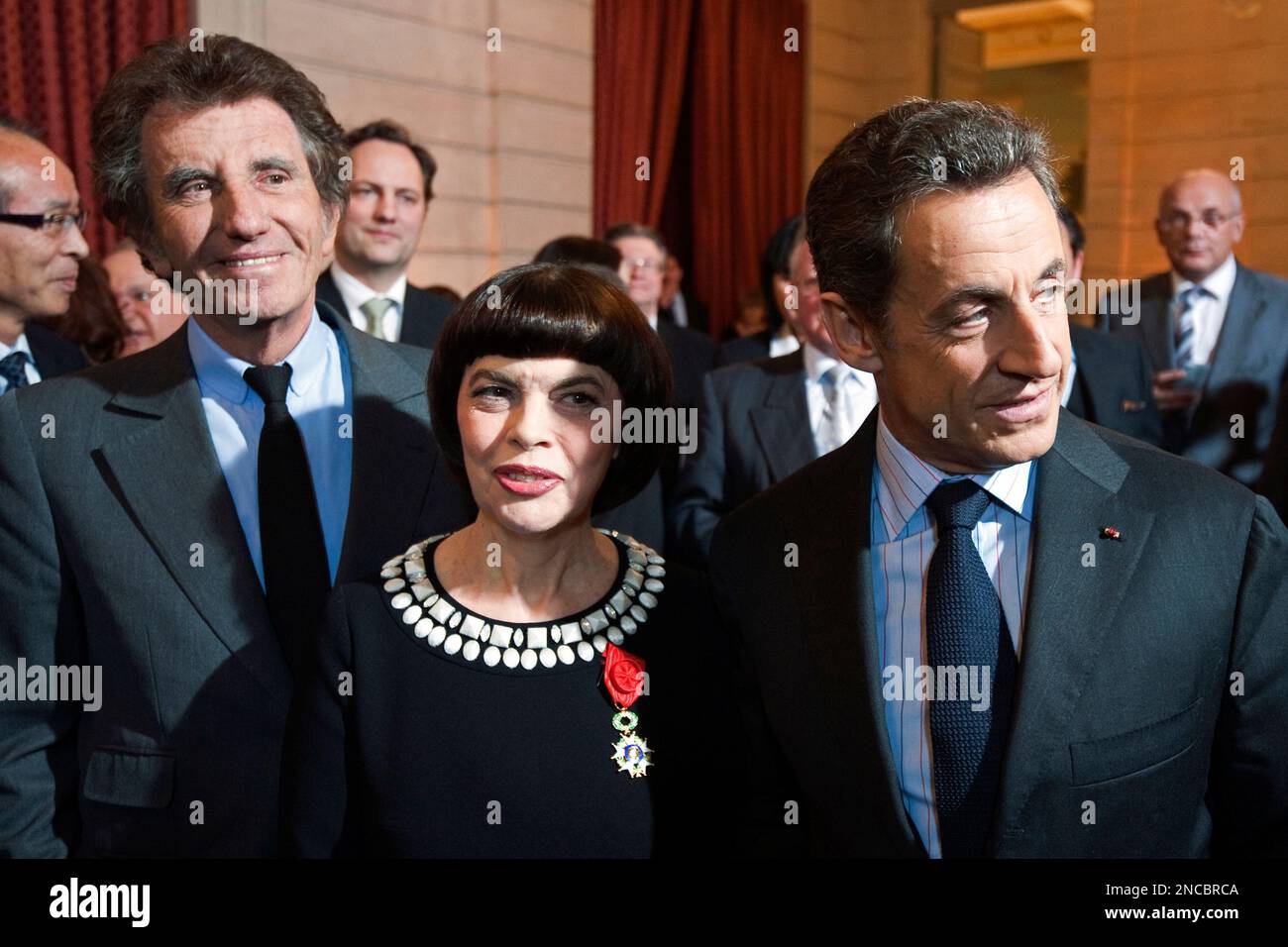 French singer Mireille Mathieu reacts with French President Nicolas ...