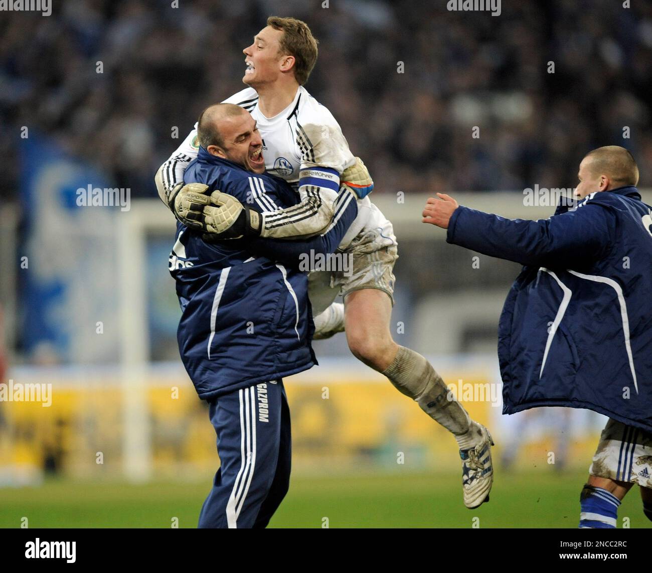 Schalke goalkeeper Manuel Neuer jumps on teammate Mathias Schober after ...