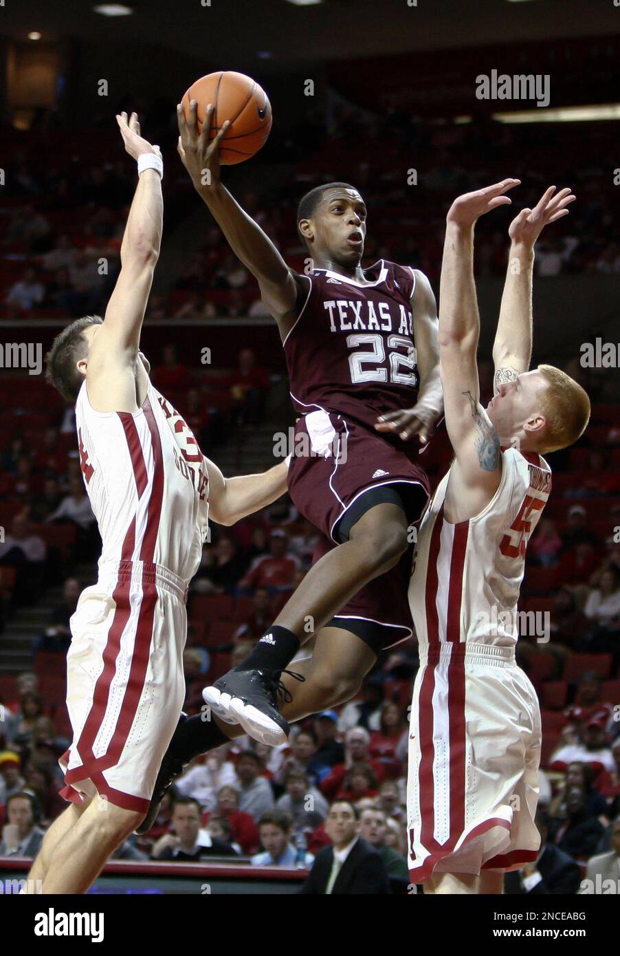 Texas A&M forward Khris Middleton, center, shoots between Oklahoma ...