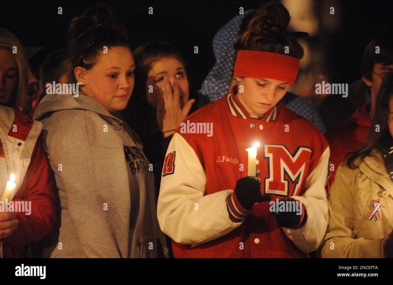 Millard South High School students hold a candle light vigil in front ...