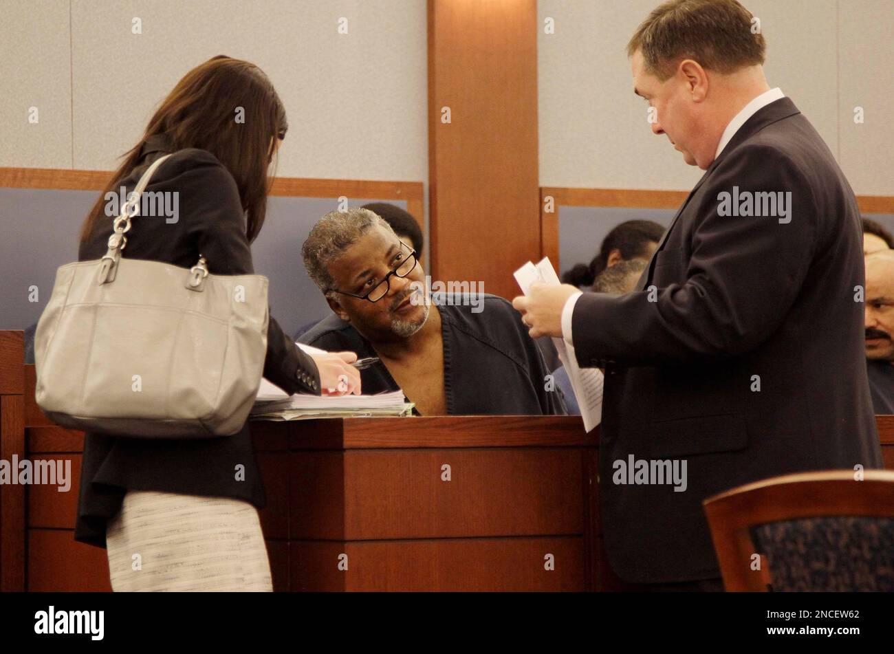 Clarence "C.J." Stewart, center, talks with Clark County district ...