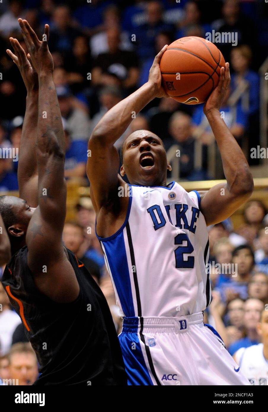 Duke's Nolan Smith (2) drives to the basket past Miami's Durand Scott ...