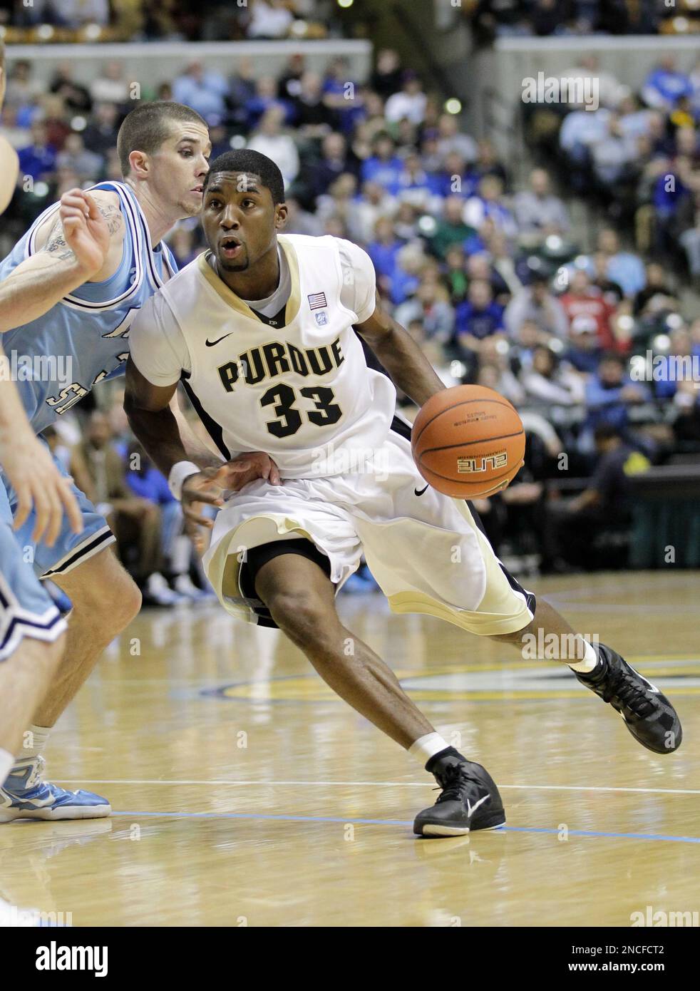 Purdue guard E'Twaun Moore, right, drives on Indiana State guard Jake ...