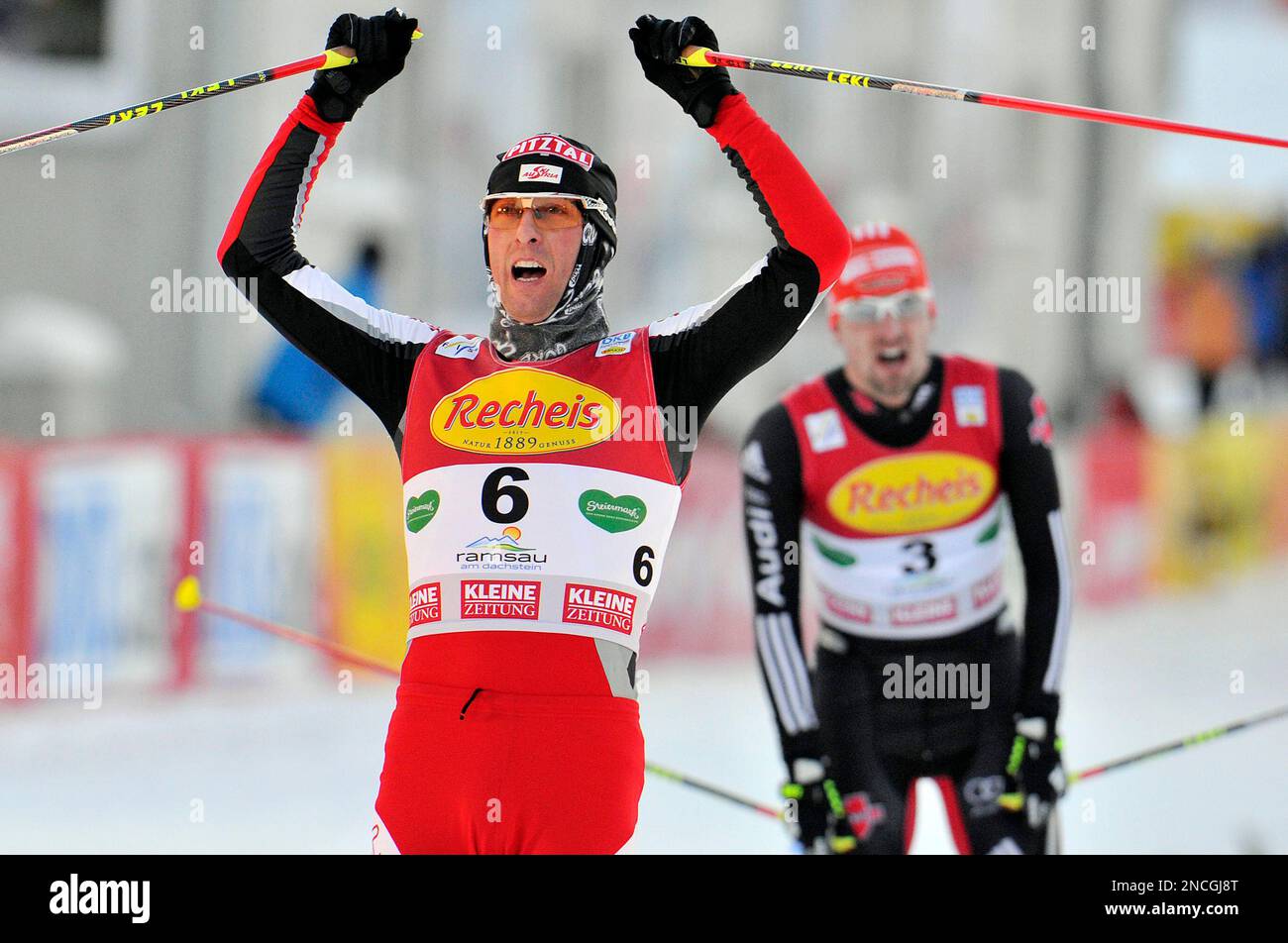 Austria's winner Mario Stecher, left, celebrates in the finish area ...
