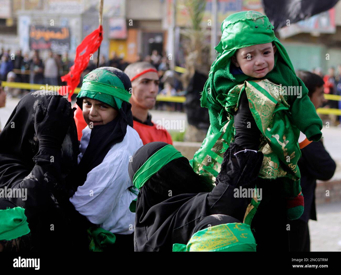 Iraqi Shiite Muslims re-enact the Battle of Karbala during Muharram, a ...