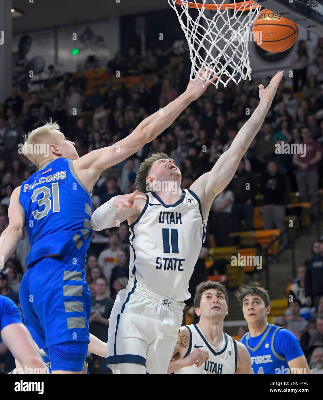 Utah State guard Max Shulga (11) shoots the ball as Air Force forward ...