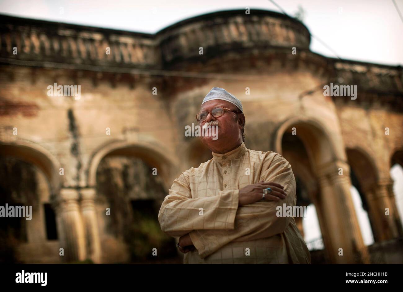 In this photo taken on Thursday, Oct. 21, 2010, Jaffar Mir Abdullah stands outside the crumbling ...