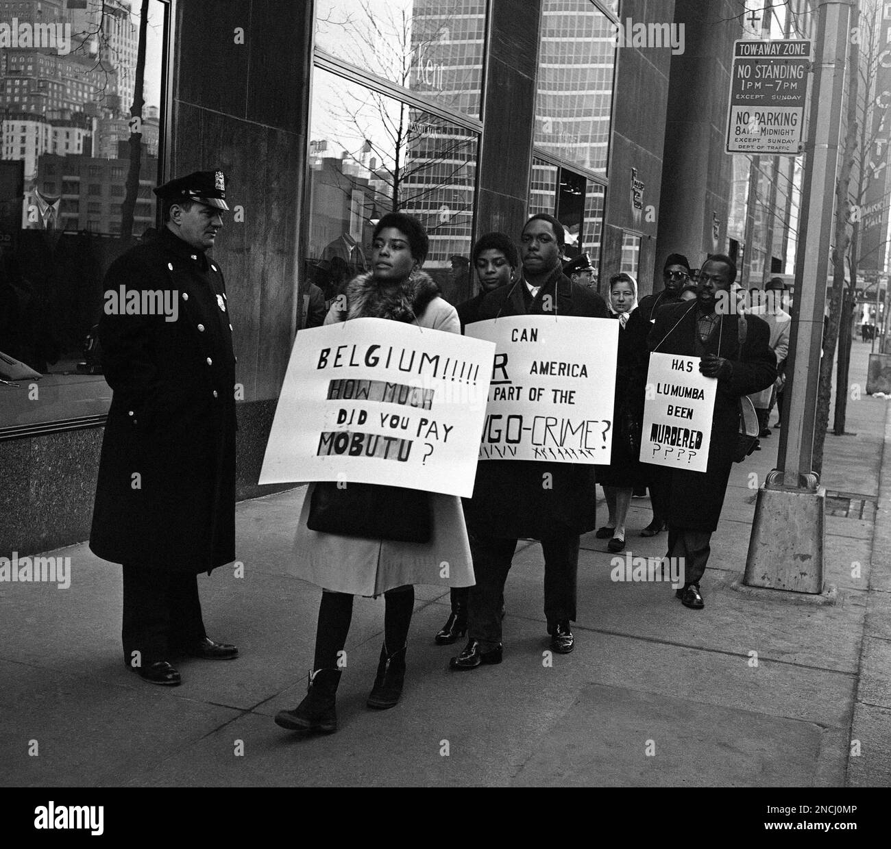 Pickets carrying anti-Belgian and pro-Lumumba placards parade on New ...