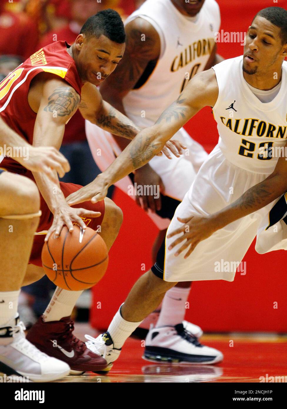 California guard Allen Crabbe, right, tries to steal the ball from Iowa ...